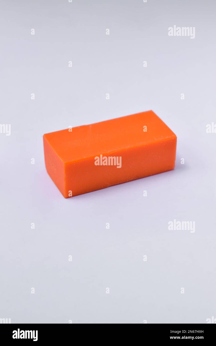 Orange eraser isolated on white background Stock Photo - Alamy