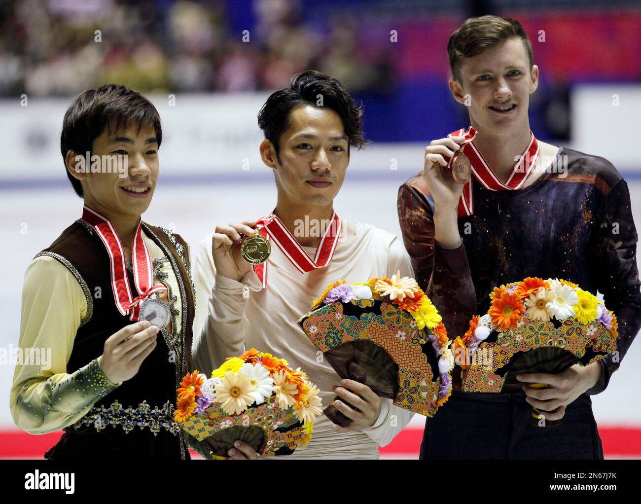 From left, bronze medalist Nobunari Oda of Japan, gold medalist Daisuke ...
