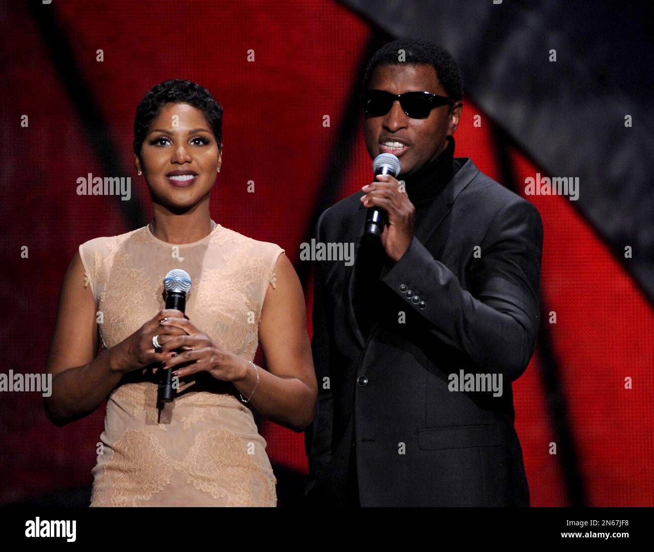 From left, Toni Braxton and Kenneth 'Babyface' Edmonds speak onstage at ...