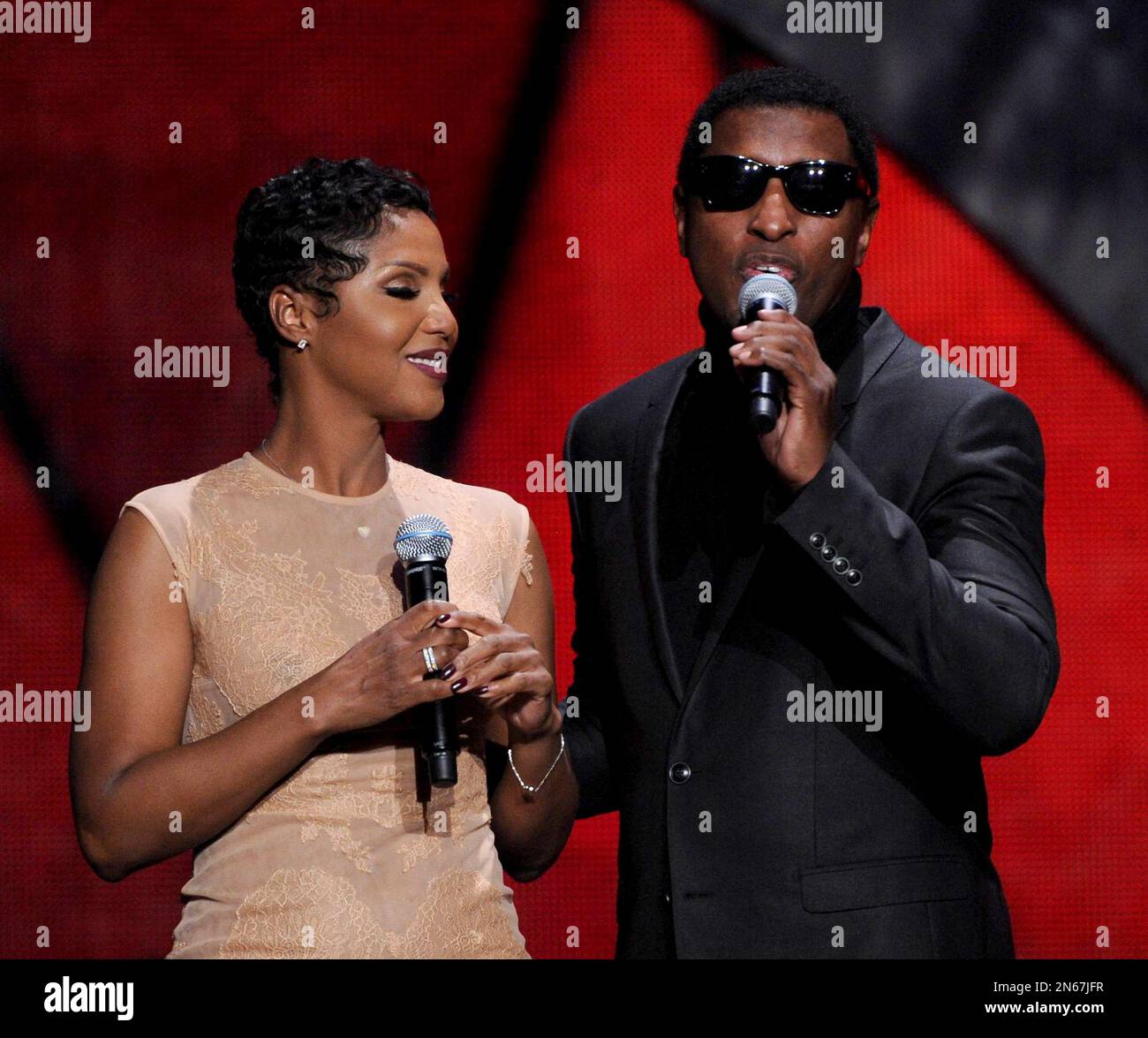 From left, Toni Braxton and Kenneth 'Babyface' Edmonds speak onstage at ...