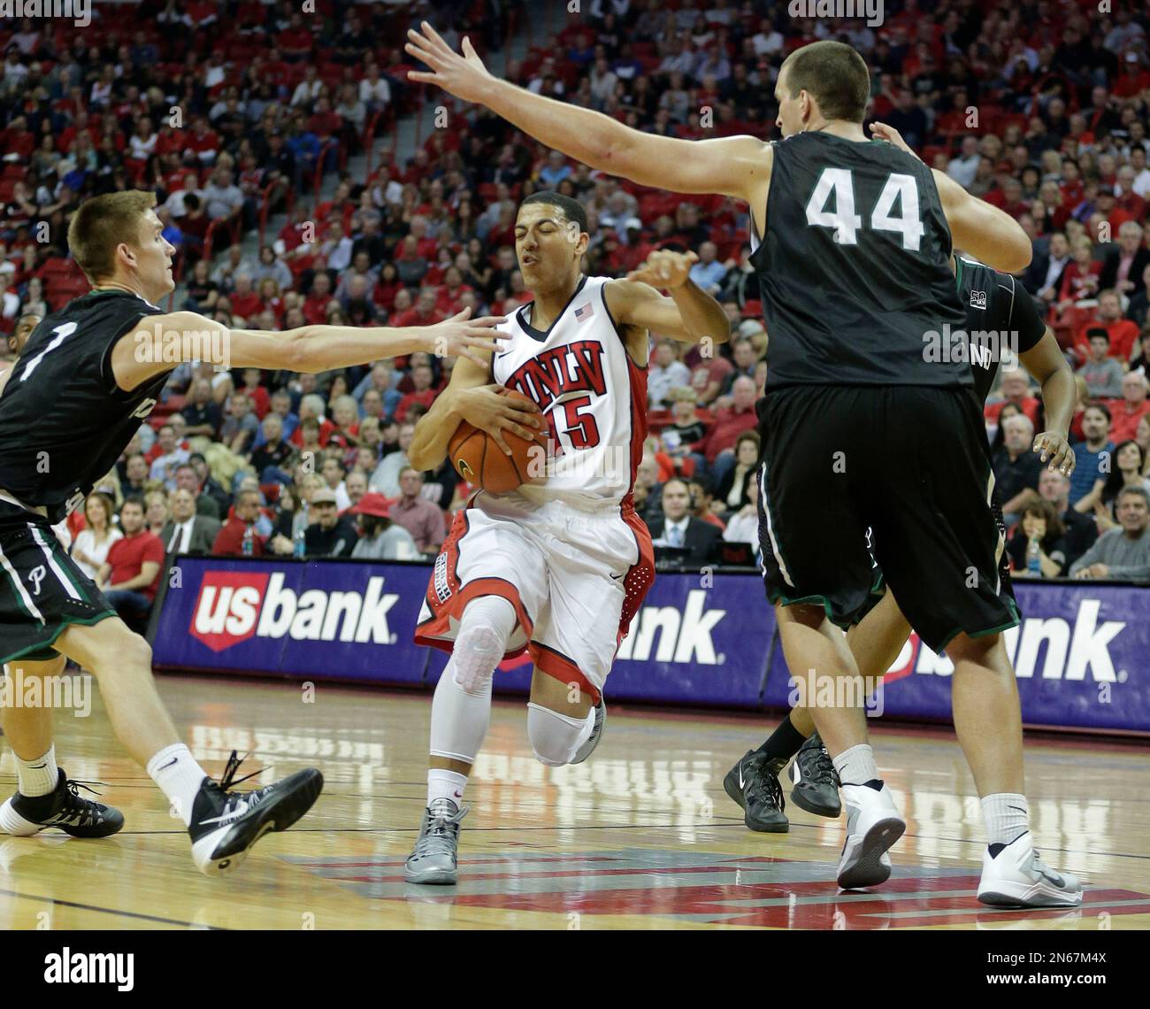 UNLV guard Kendall Smith (15) splits the defense of Portland State ...
