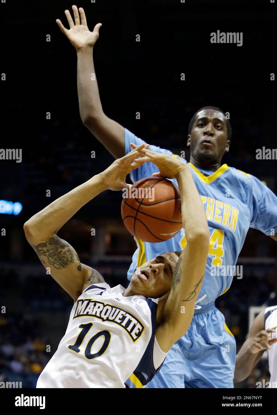 Marquette's Juan Anderson loses the ball as he tries to drive past ...