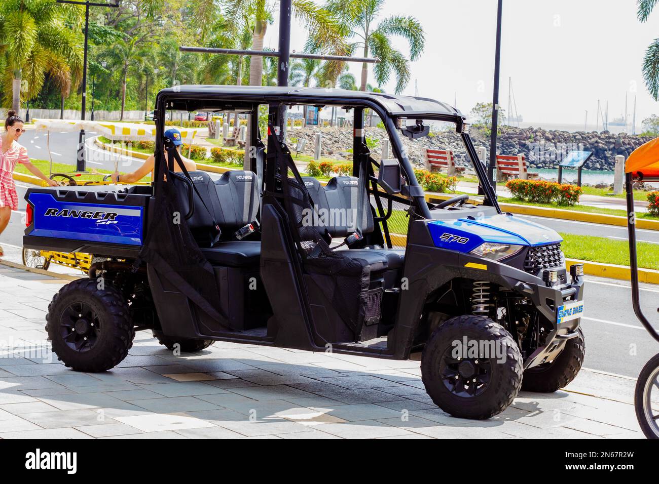 parked tourist car, blue and black Stock Photo - Alamy