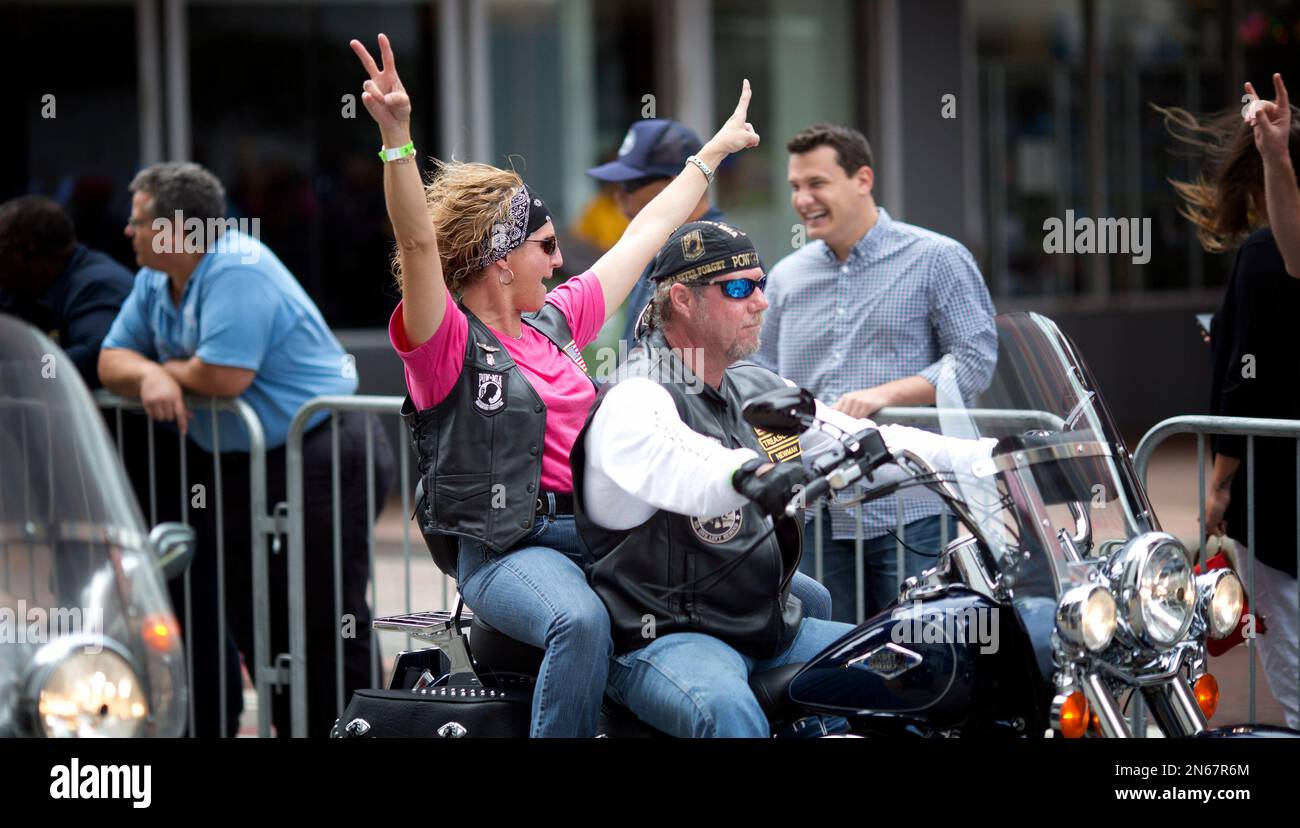 A couple celebrate during the Golden Veteran Parade in Miami, Friday ...