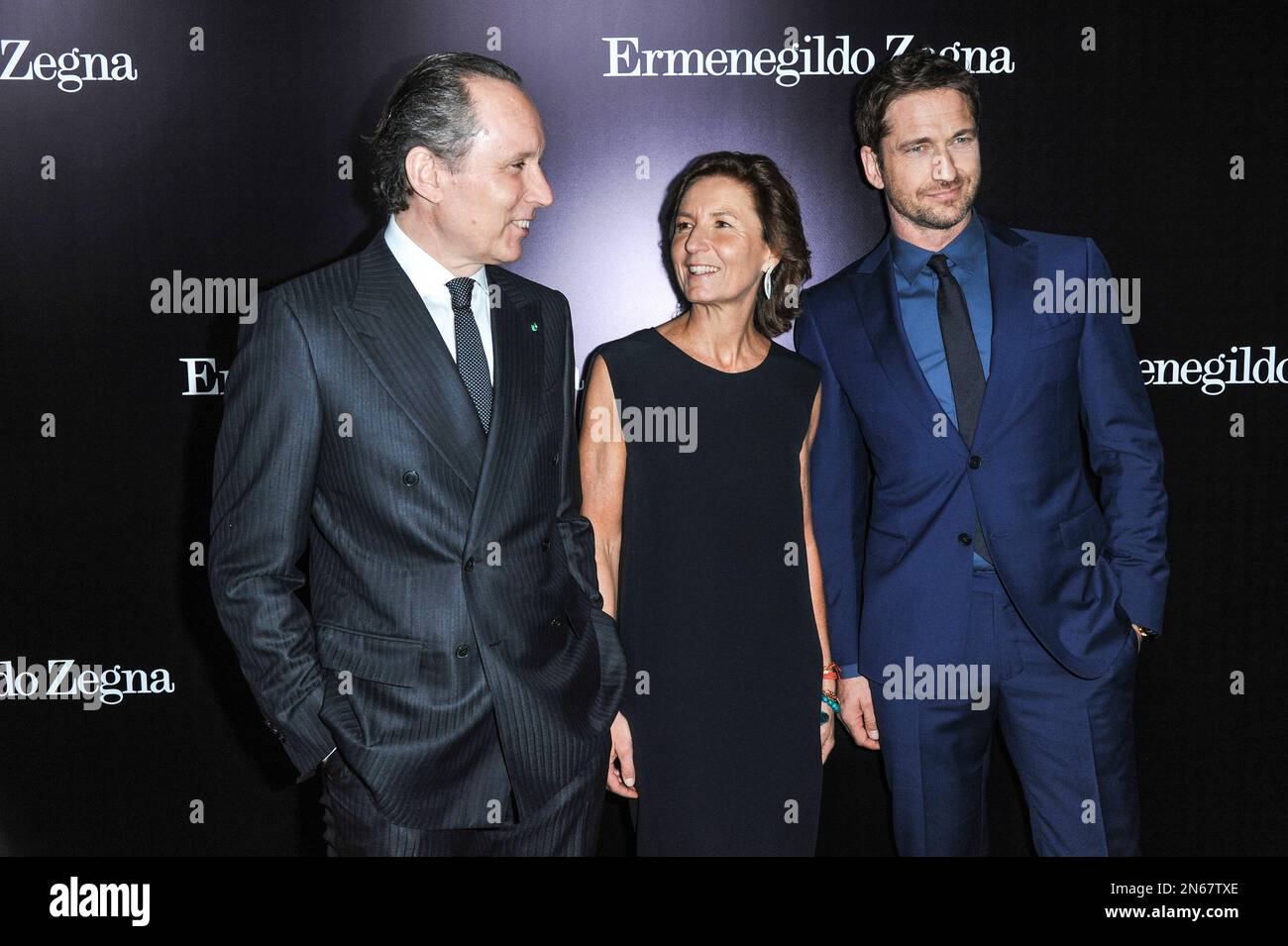 From left, Gildo Zegna, Anna Zegna, and Gerard Butler arrive at the ...