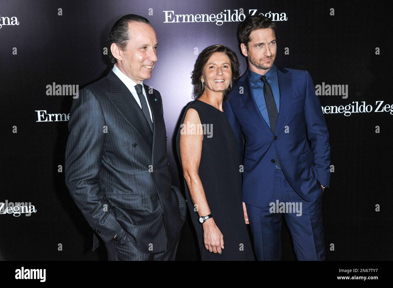 From left, Anna Zegna, Gildo Zegna, and Gerard Butler arrive at the ...