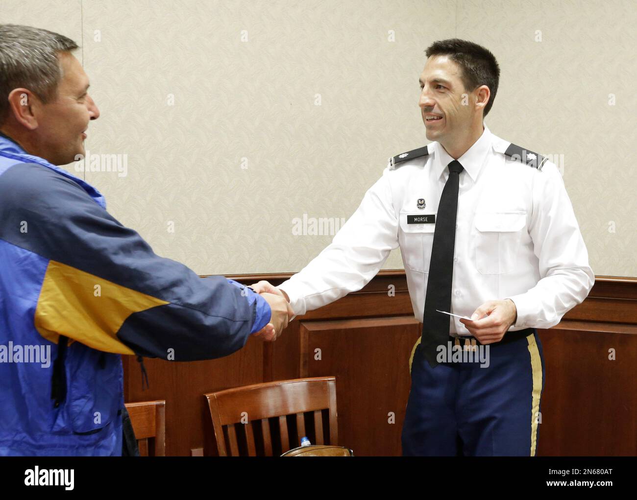 Military prosecutor U.S. Army Lt. Col. Jay Morse, shakes hands with a ...
