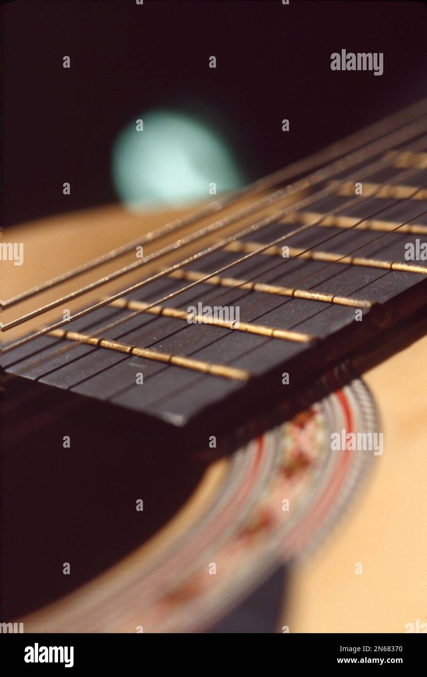 Close-up of the neck of the guitar showing the strings and frets Stock ...