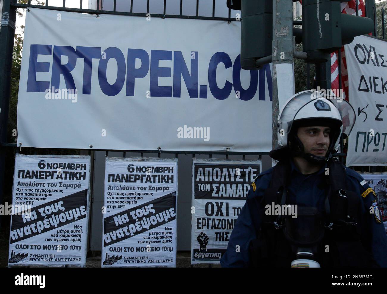 A policeman guards outside the main entrance of ERT headquarters in the ...
