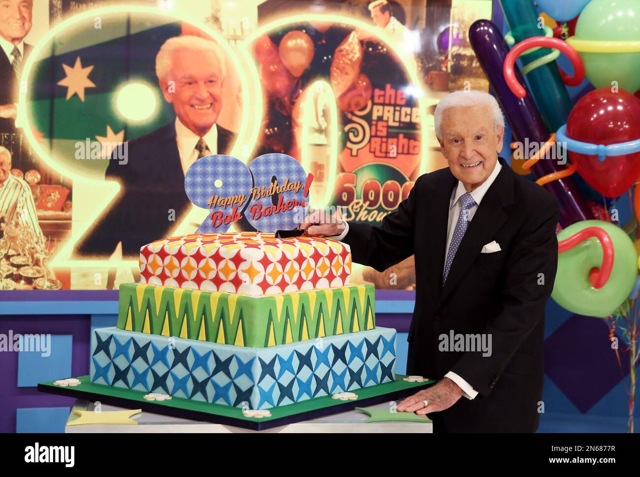 Bob Barker poses for a photo on the set of "The Price is Right" after a ...