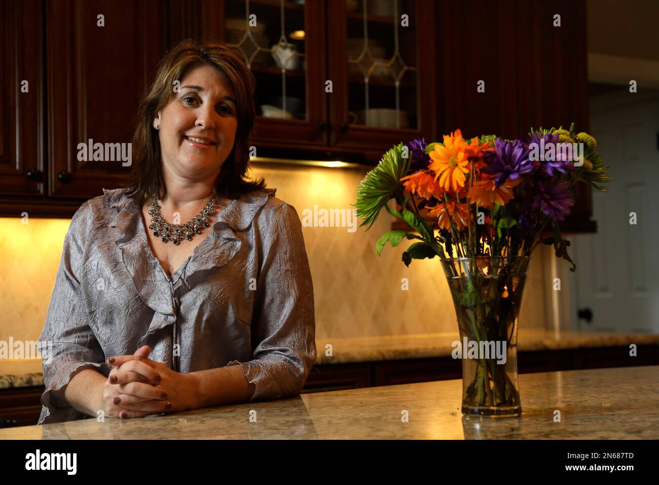 In this Tuesday, Nov. 5, 2013 photo, Jill Morin poses for photos at her ...