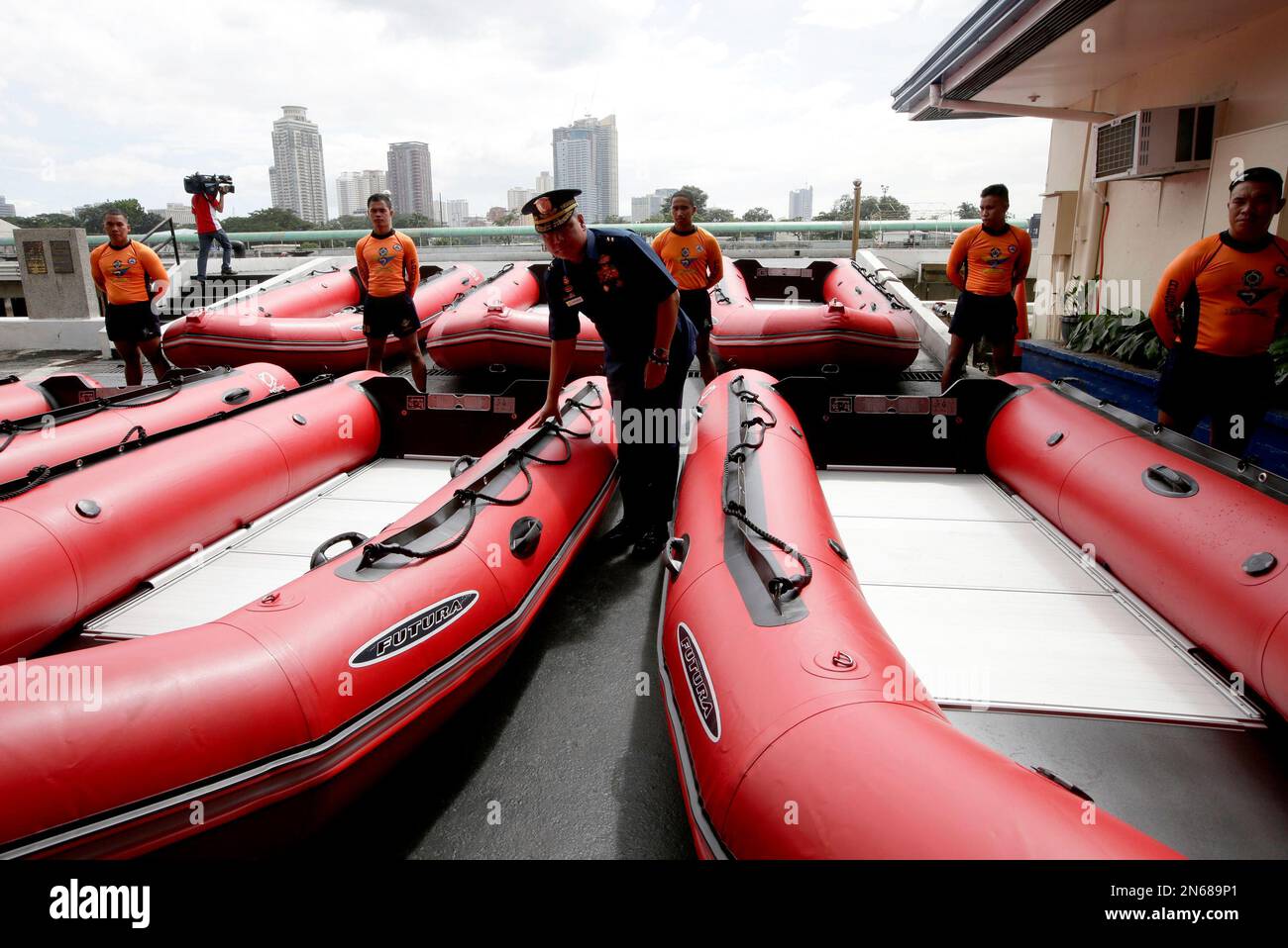 Philippine Coast Guard Chief Rear Adm. Rodolfo Isorena checks newly ...