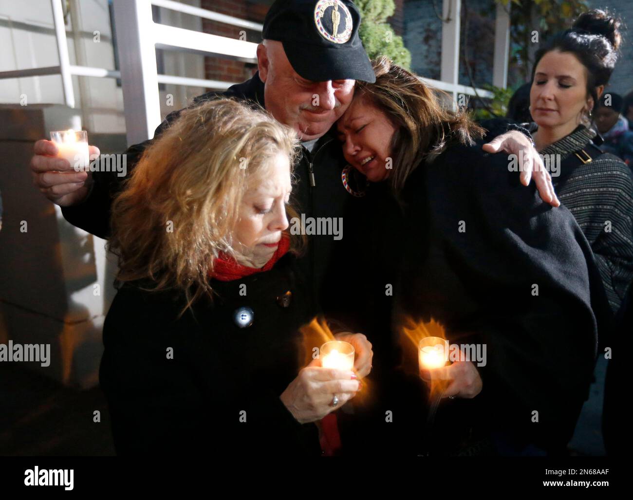 Chef John Kaufmann, center, consoles Chef Priscila Satkoff, right, and ...