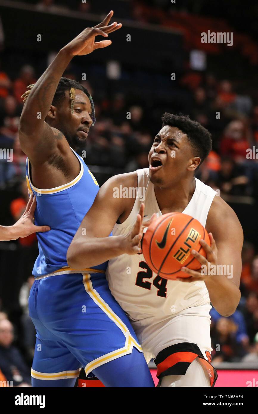 Oregon State center KC Ibekwe (24) tries to shoot around UCLA forward ...
