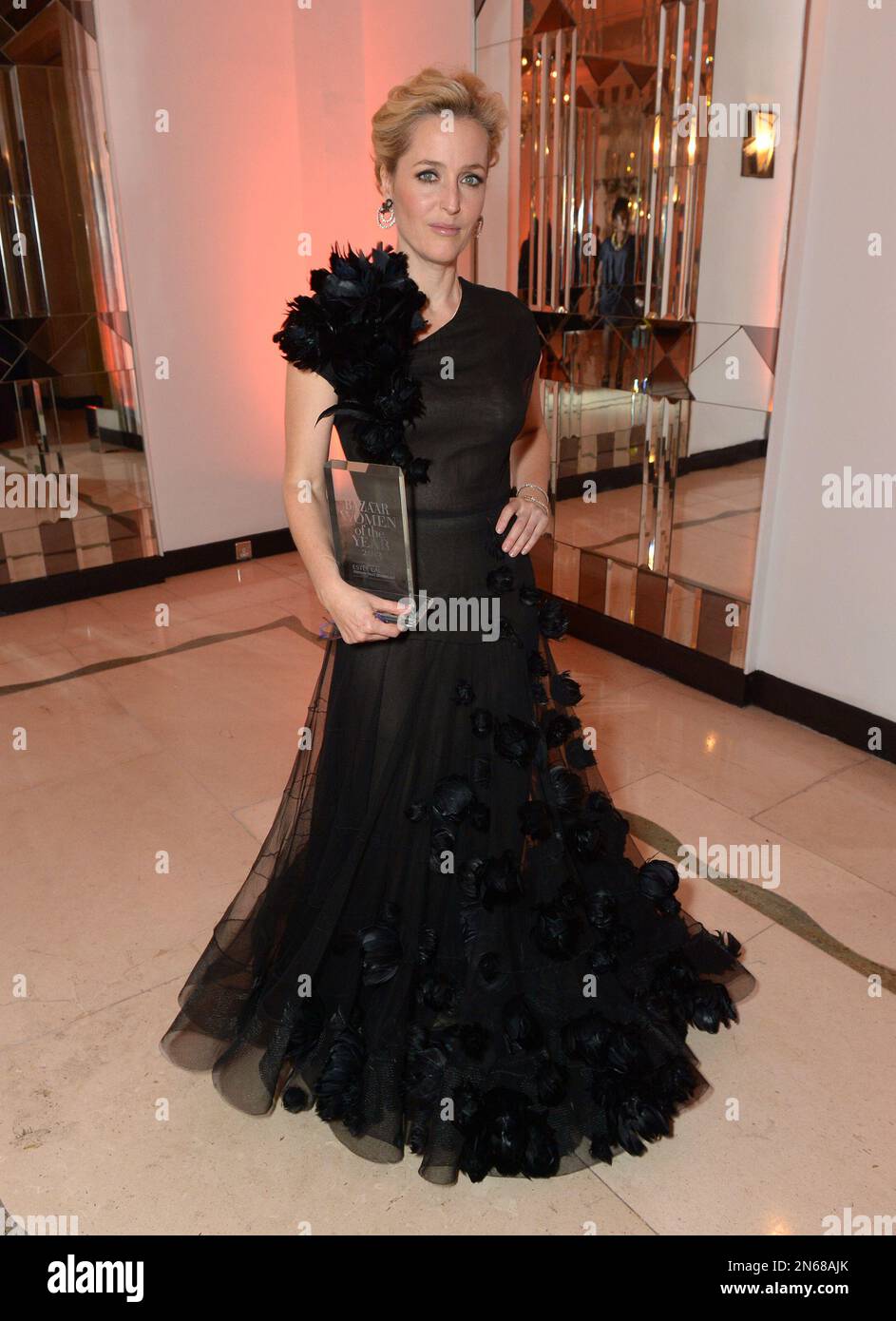 Gillian Anderson, winner of the Television Icon Award poses for ...