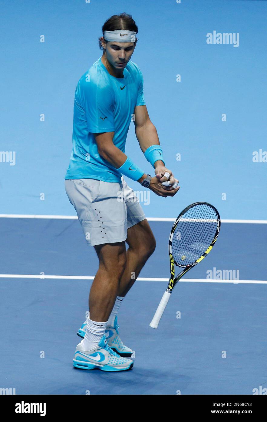 Rafael Nadal of Spain drops his racket during his ATP World Tour Finals ...