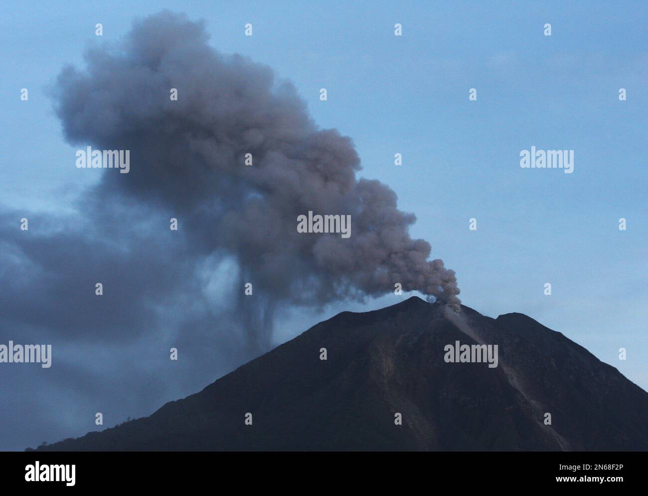 Mount Sinabung spews volcanic ash as seen from Tiga Pancur, North ...