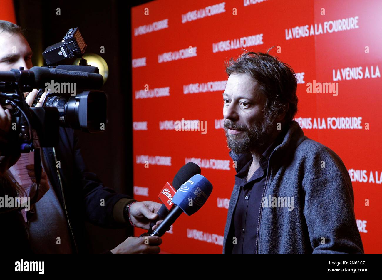 French actor Mathieu Amalric, answers reporter as he arrives for the ...