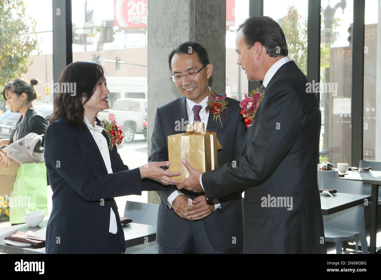 Joanne Yang, Frank Yang and Rick Caruso at the ribbon cutting ceremony ...