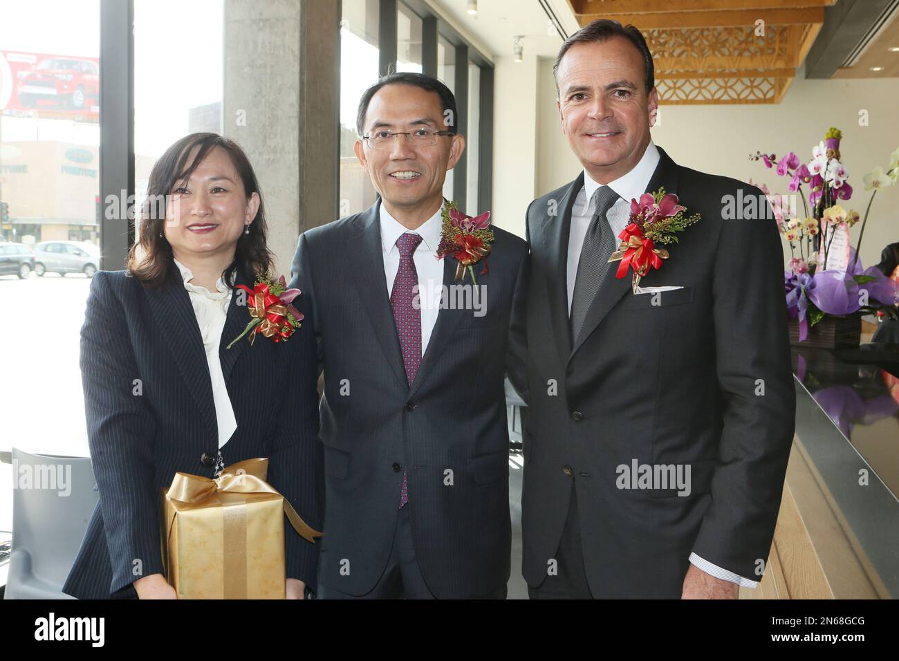 Joanne Yang, Frank Yang and Rick Caruso at the ribbon cutting ceremony ...