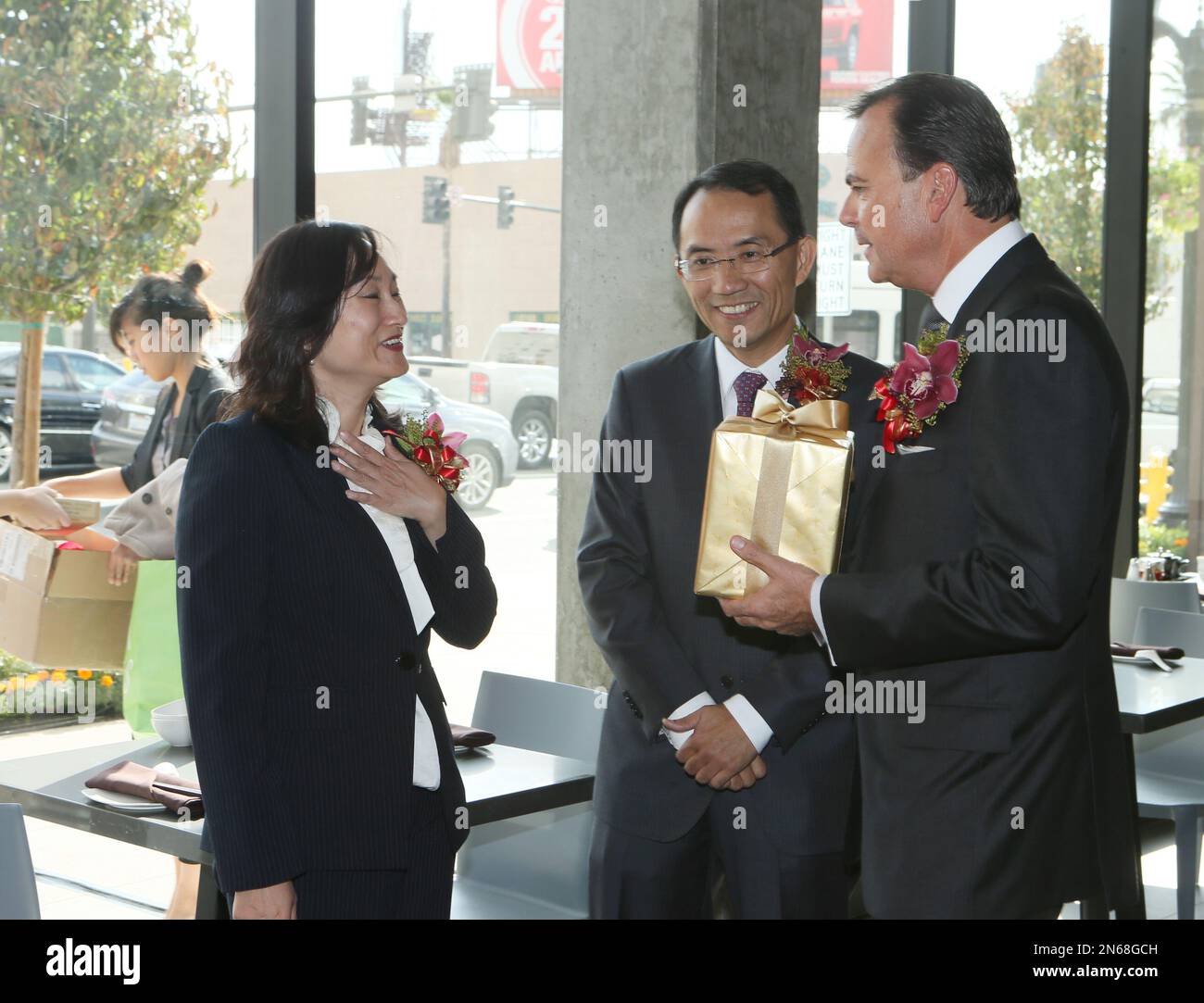 Joanne Yang, Frank Yang and Rick Caruso at the ribbon cutting ceremony ...