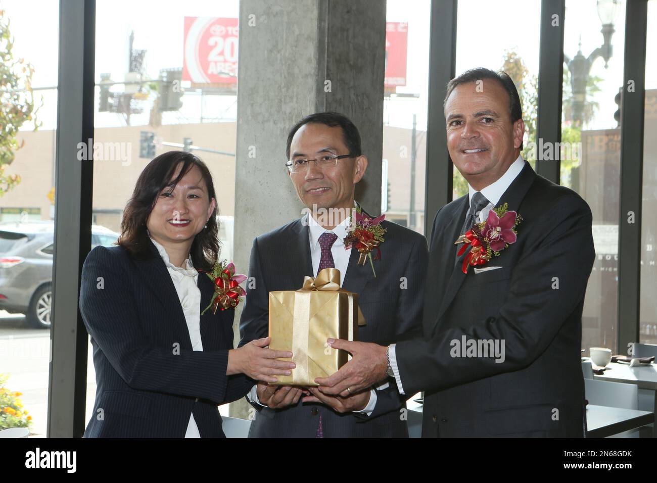 Joanne Yang, Frank Yang and Rick Caruso at the ribbon cutting ceremony ...
