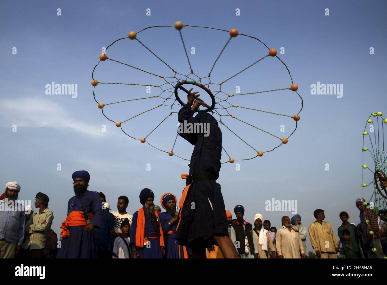 A Nihang or a traditional Sikh religious warrior performs 'Gatka' a ...