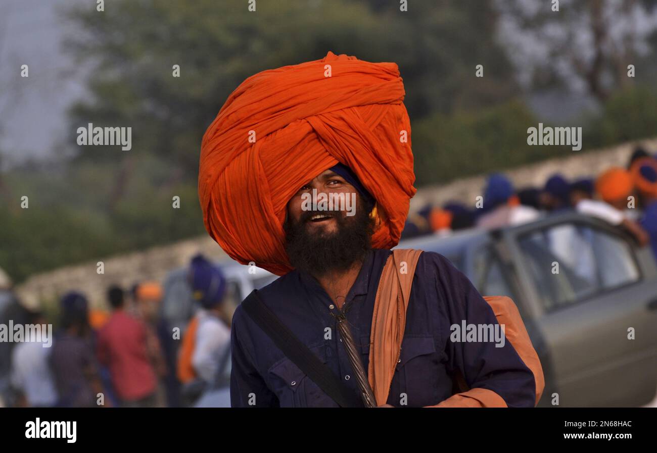 A Nihang or a traditional Sikh religious warrior wearing an oversized ...