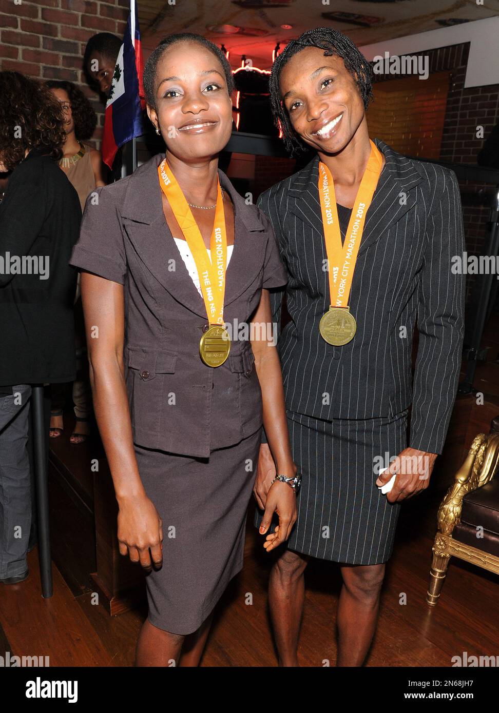 Haitian J/P HRO team members Carline Lamour, left, Bertine Lainé attend ...