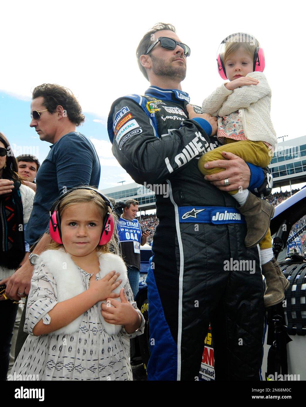 Jimmie Johnson stands with his daughter Genevieve Marie as family ...