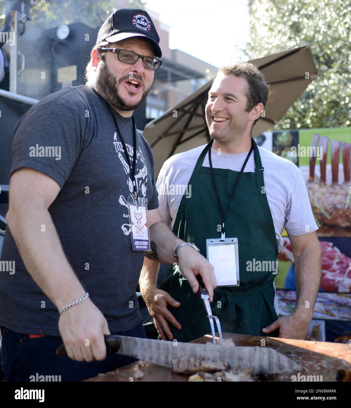 IMAGE DISTRIBUTED FOR GEORGE DICKEL - Barbecue chef Adam Perry Lang, right, shows Meatopia ...