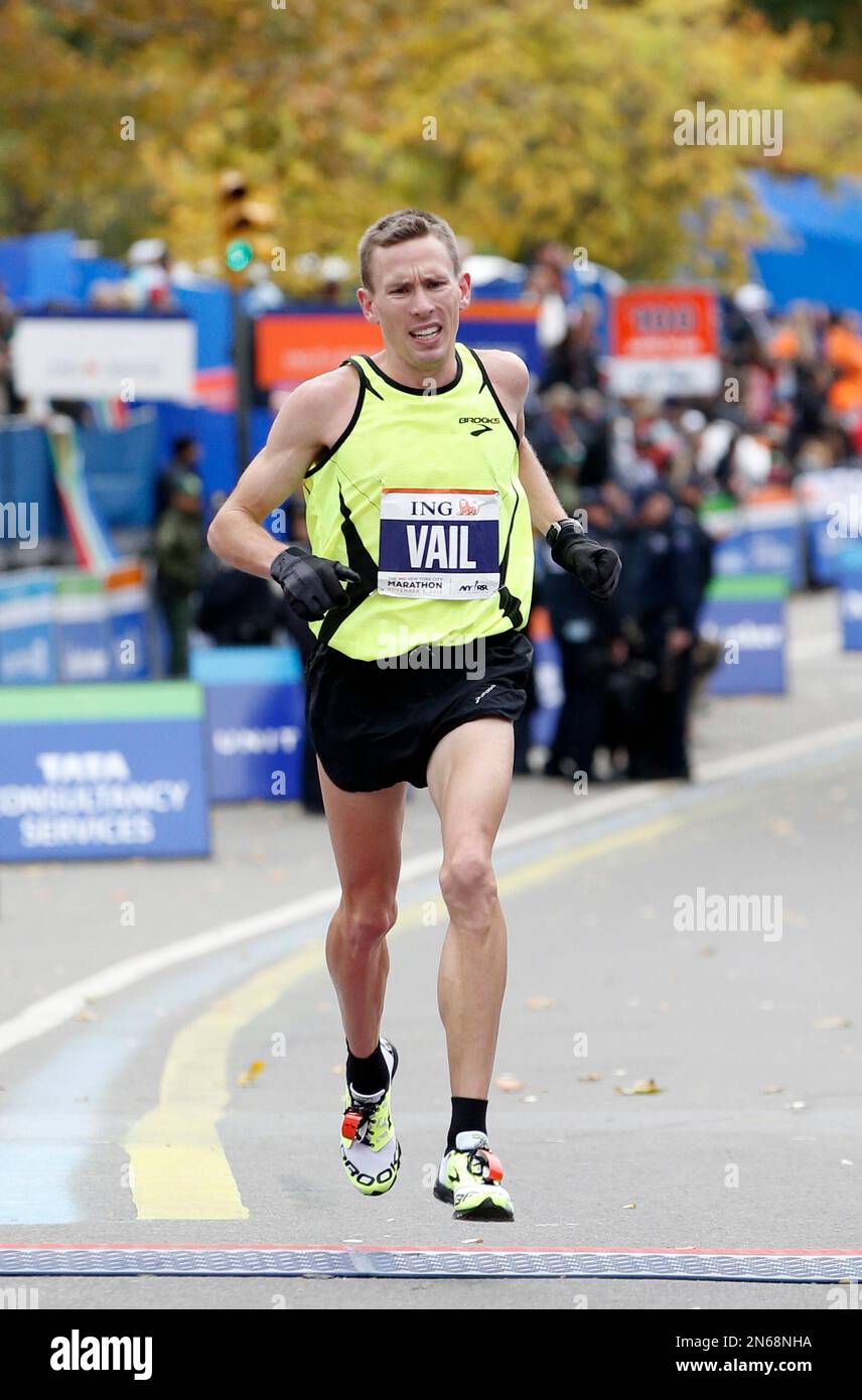 Ryan Vail of Portland, Ore. crosses the finish line in 15th place but ...