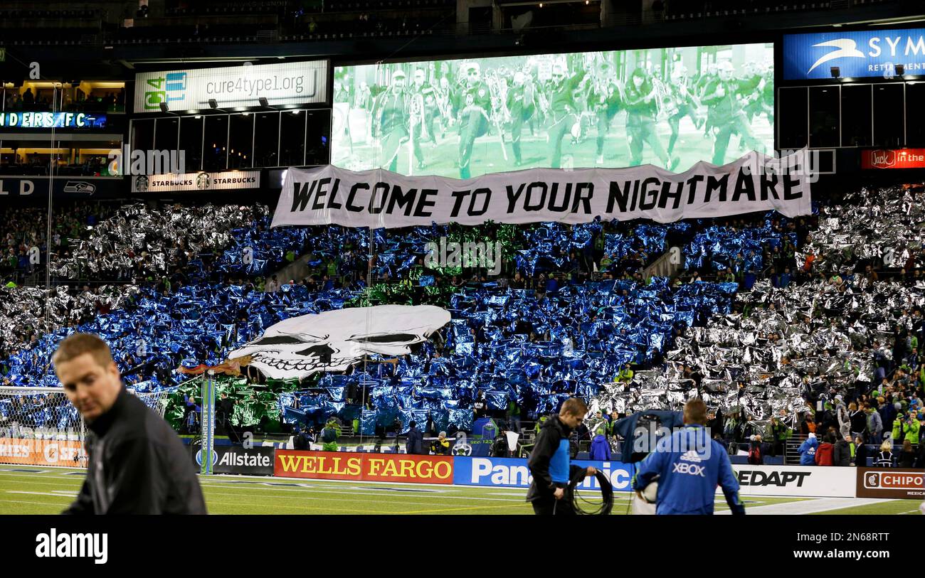 Seattle Sounders supporters hold up a "tifo" display that says "Welcome ...