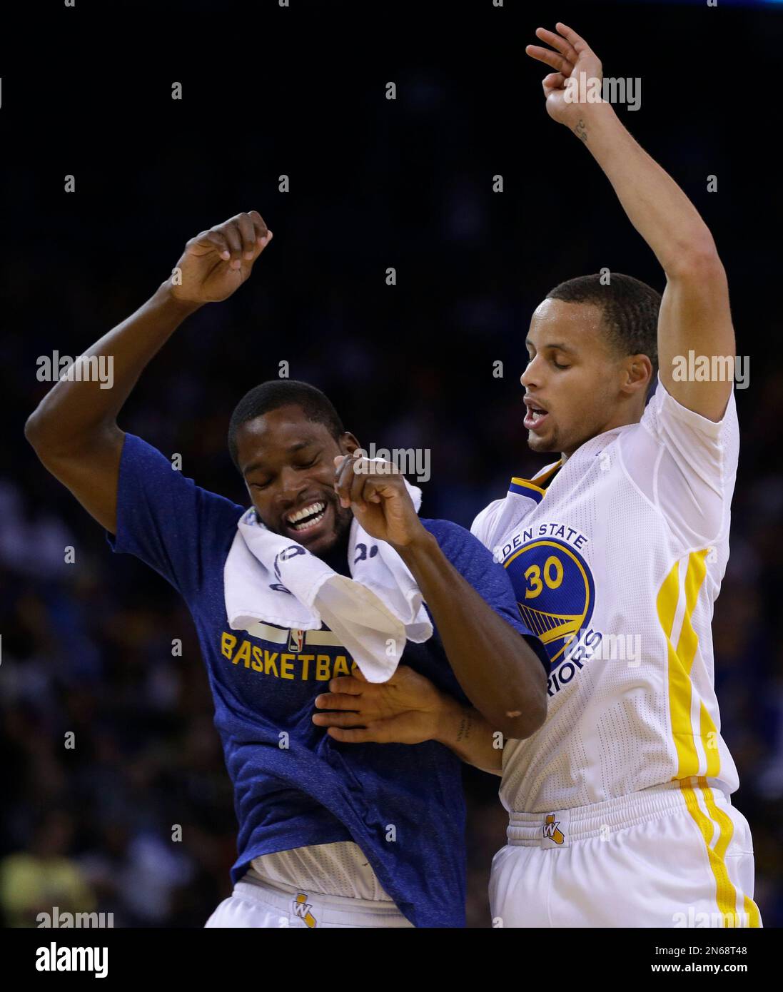 Golden State Warriors' Toney Douglas, left, and Stephen Curry (30 ...