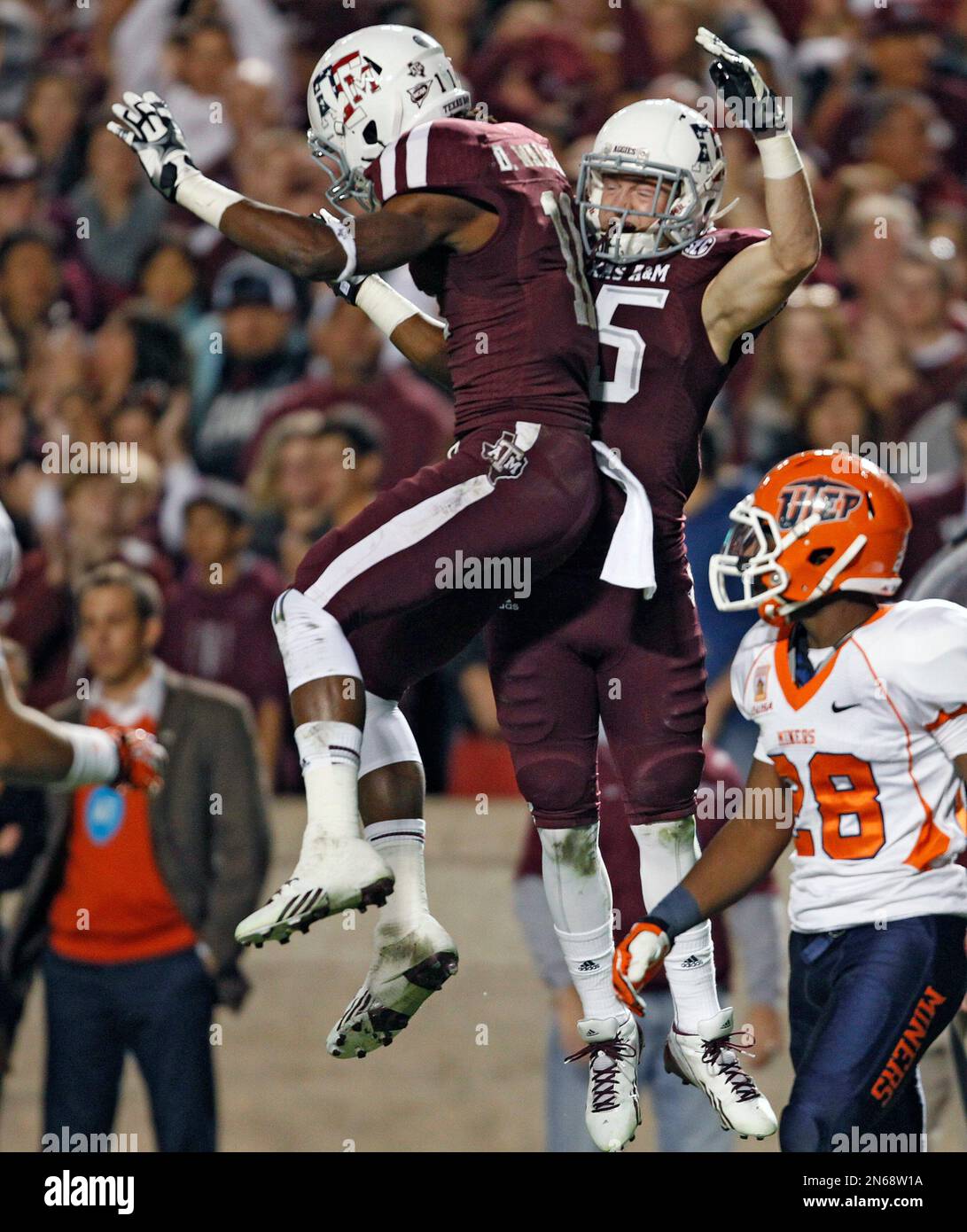 Texas A&M's Travis Labhart, center, celebrates his 44-yard touchdown ...