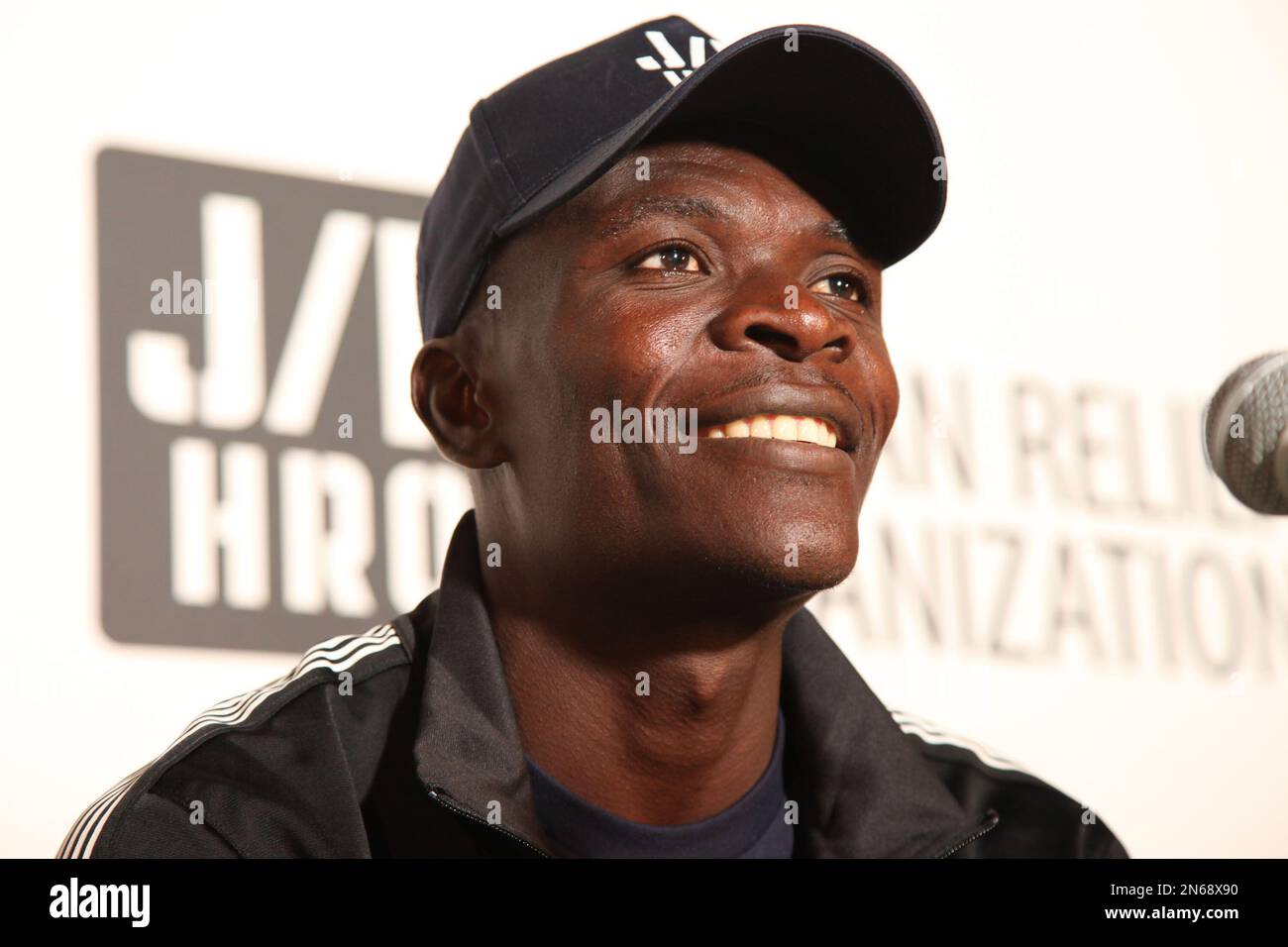 Haitian runner Jean Macksony speaks during the J/P Haitian Relief ...