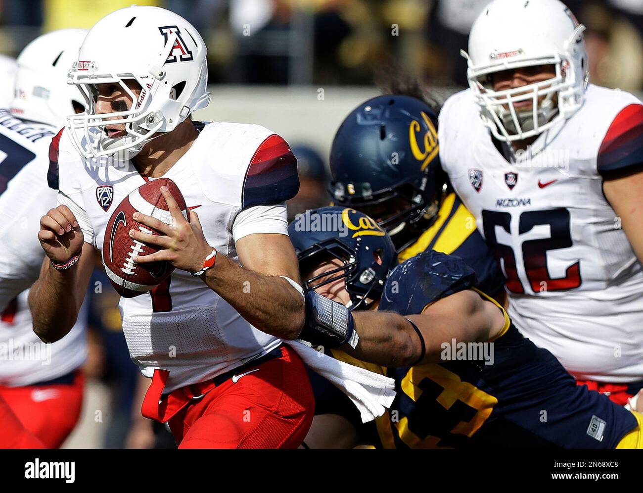 Arizona quarterback B.J. Denker (7) runs away from California defensive ...