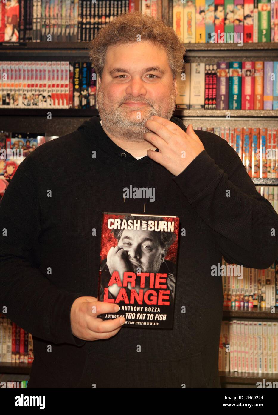 Comedian and actor Artie Lange holds his new autobiography Crash and ...