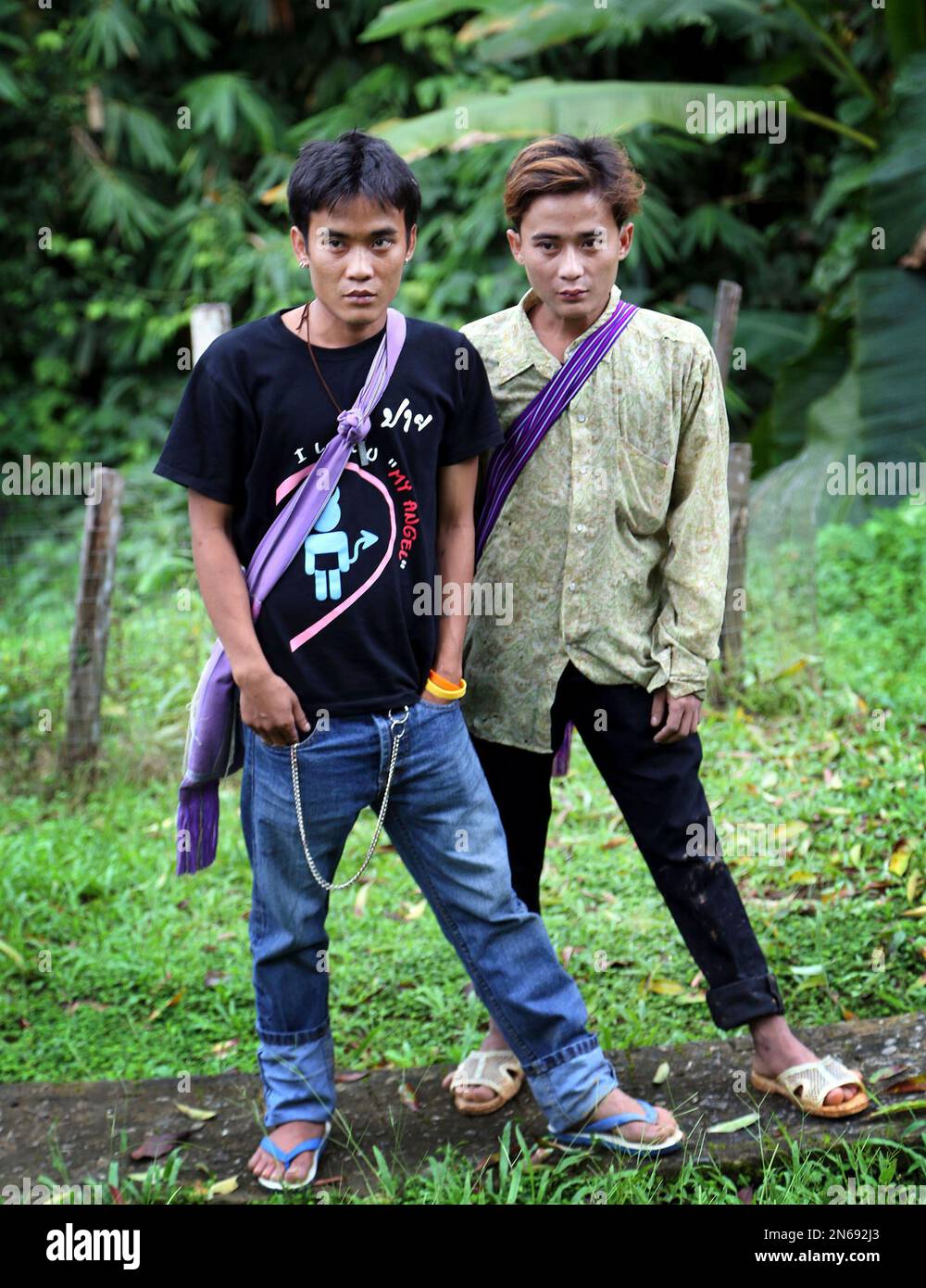 In this Sept. 26, 2013 photo, Johnny, right, and his twin brother ...