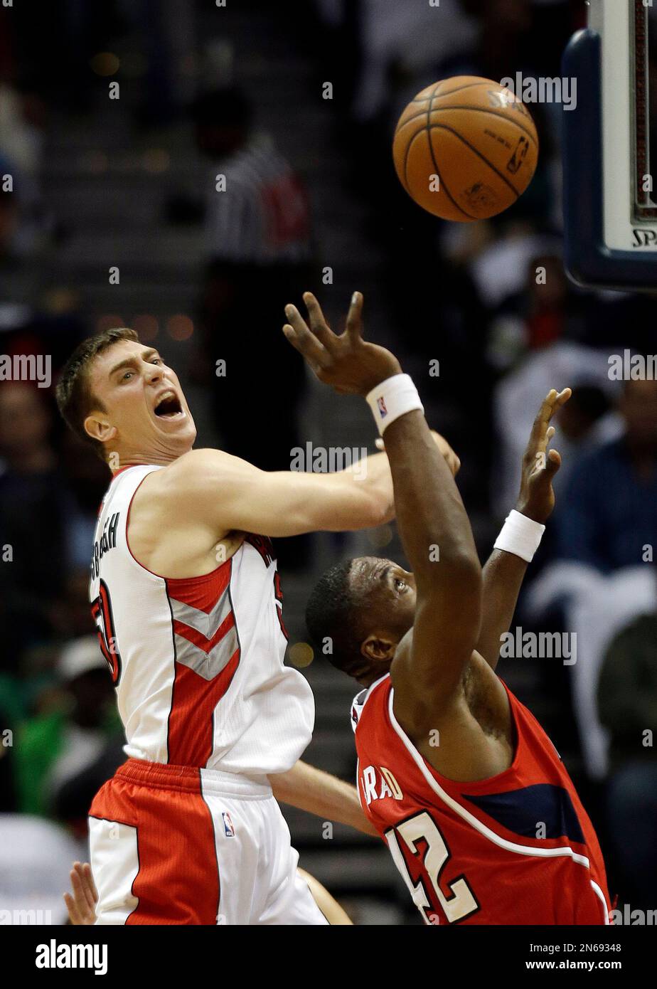 Toronto Raptors power forward Tyler Hansbrough, left, and Atlanta Hawks ...
