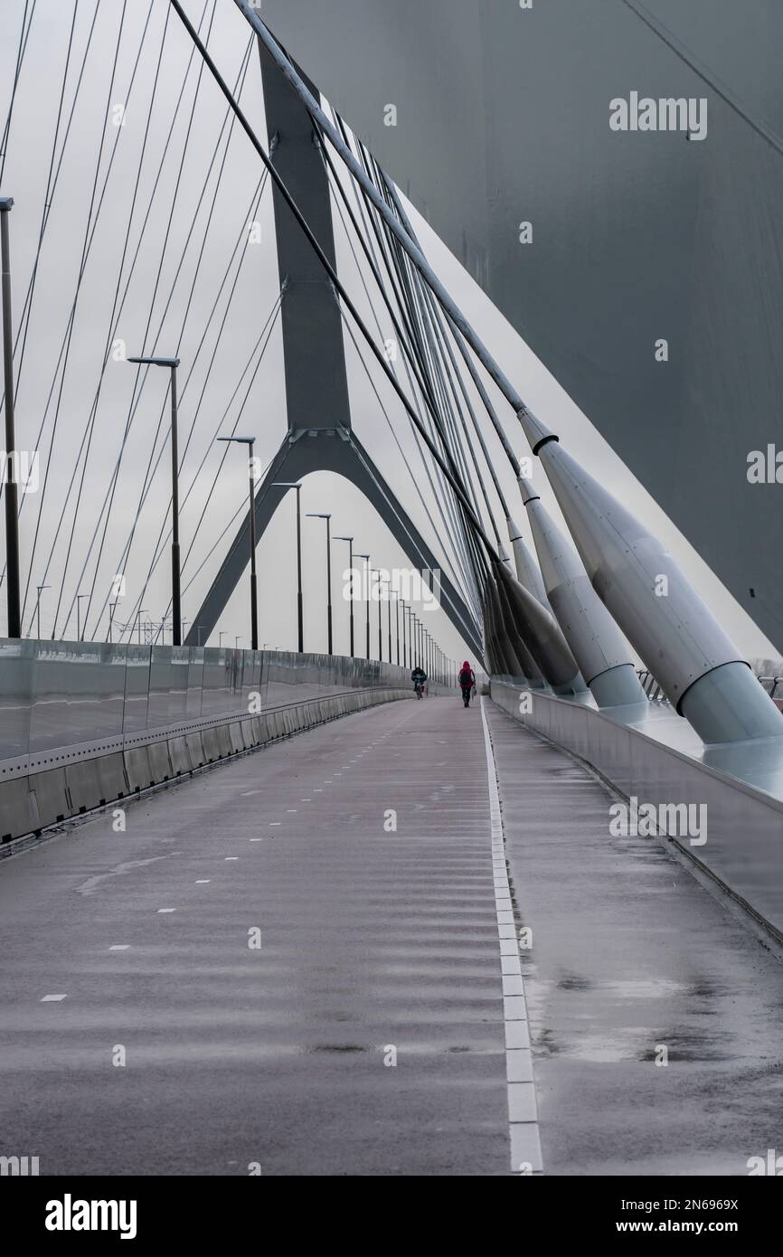 A grayscale view of people walking on Leonard P. Zakim Bunker Hill ...