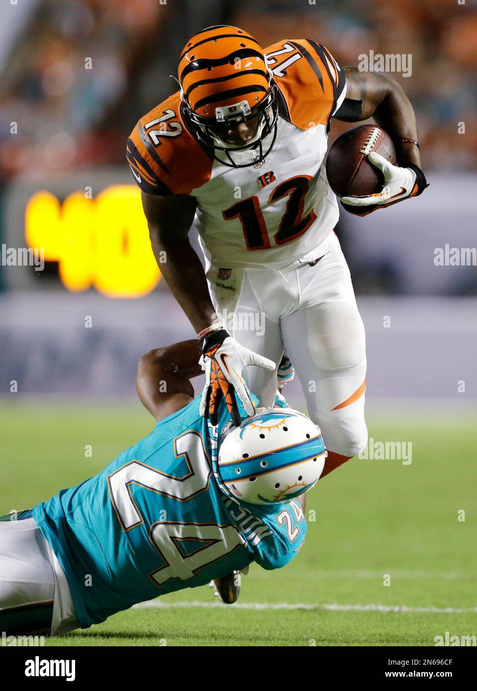 Miami Dolphins cornerback Dimitri Patterson (24) tackles Cincinnati ...