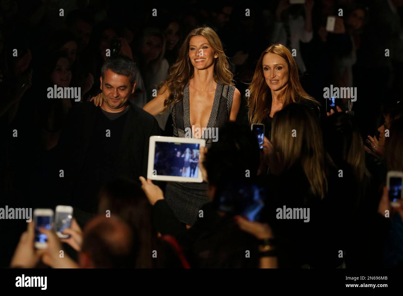 Brazilian top model Gisele Bundchen, center, enters the catwalk ...