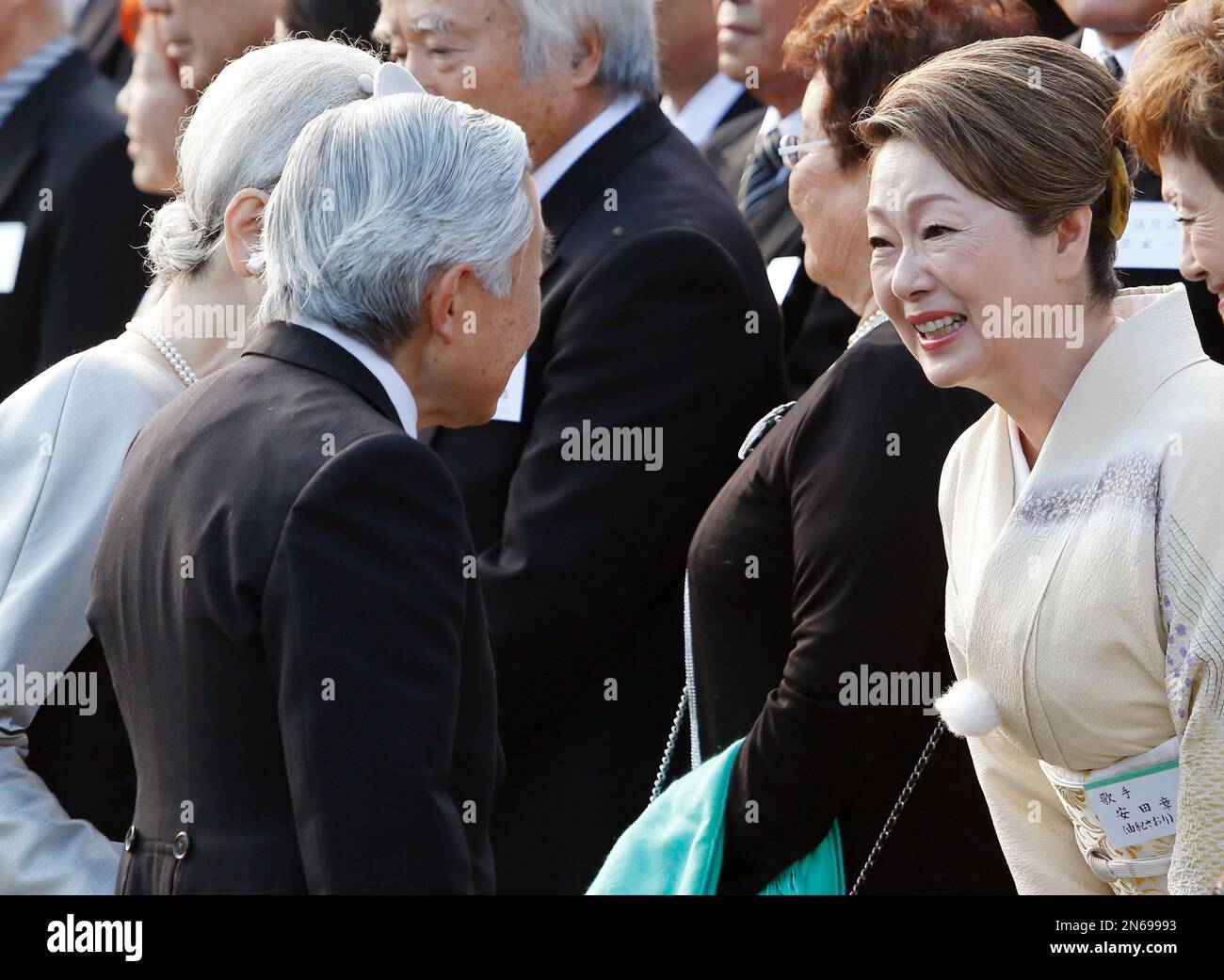 Japanese singer Saori Yuki, right, talks with Japan's Emperor Akihito ...