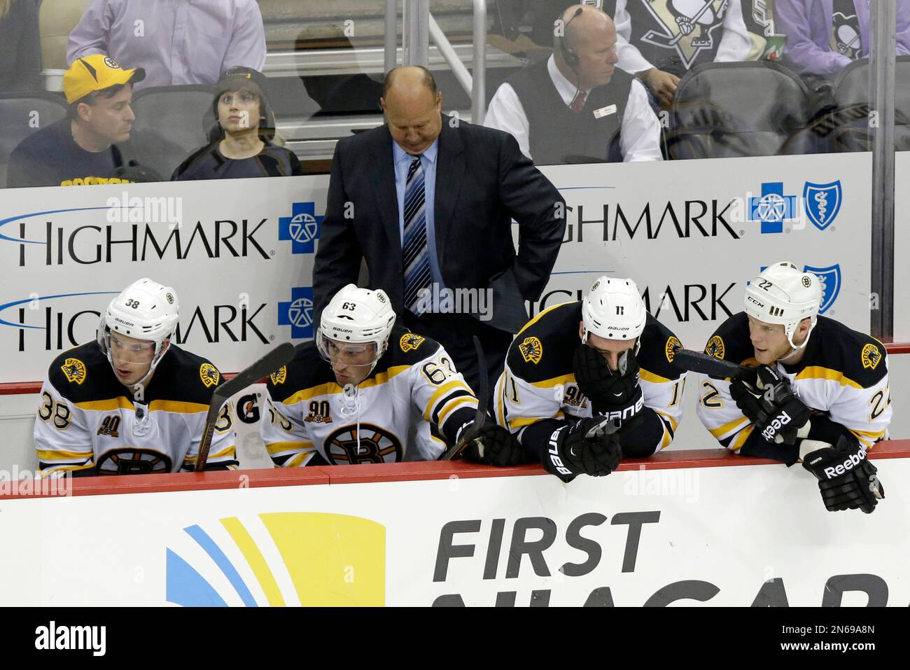 Boston Bruins coach Claude Julien stands behind Bruins' Jordan Caron ...