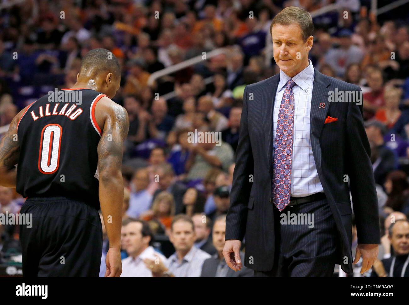 Portland Trail Blazers coach Terry Stotts walks onto the floor past ...