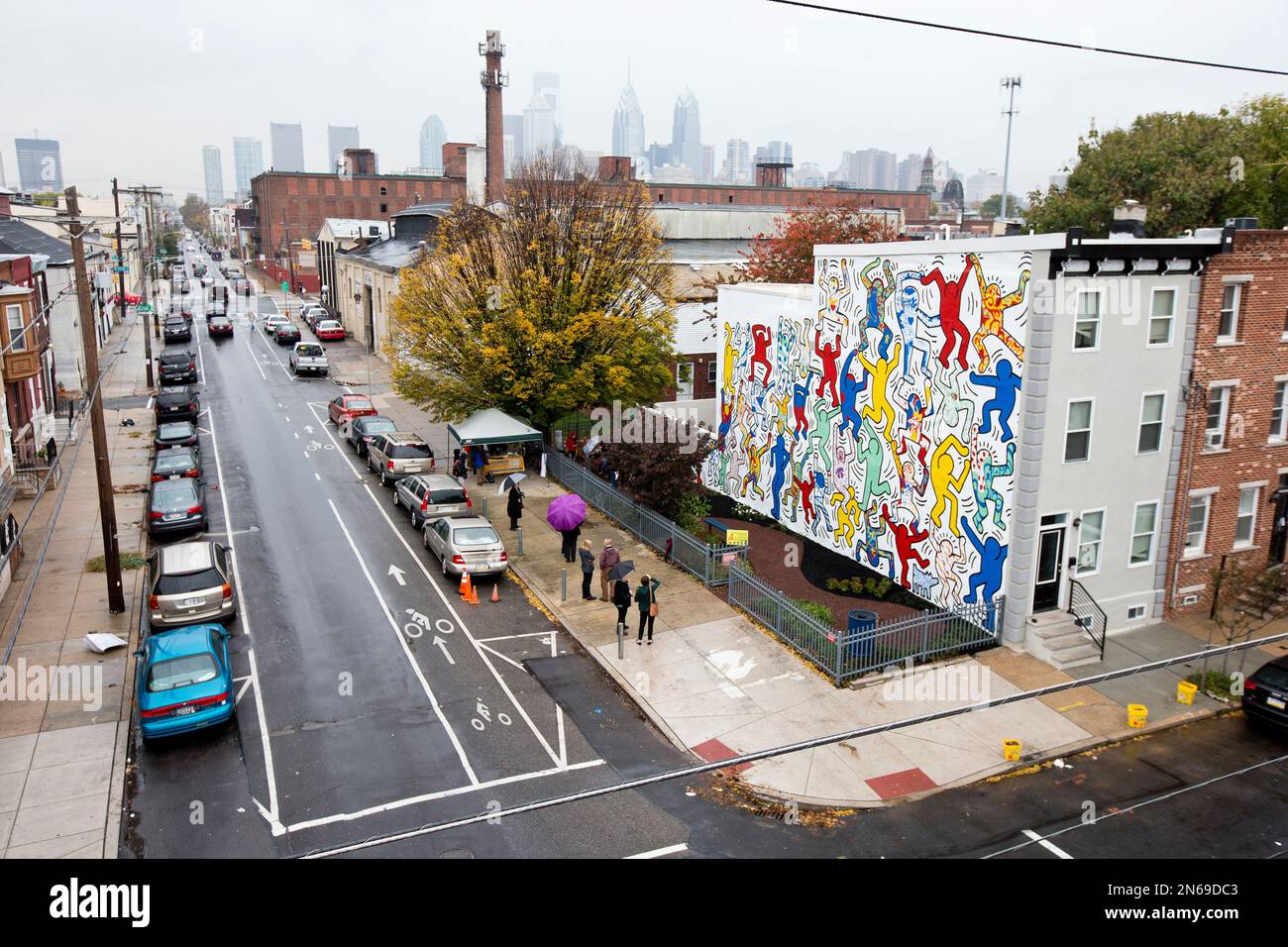 Shown is a newly restored 1987 mural titled "We The Youth" by artist ...