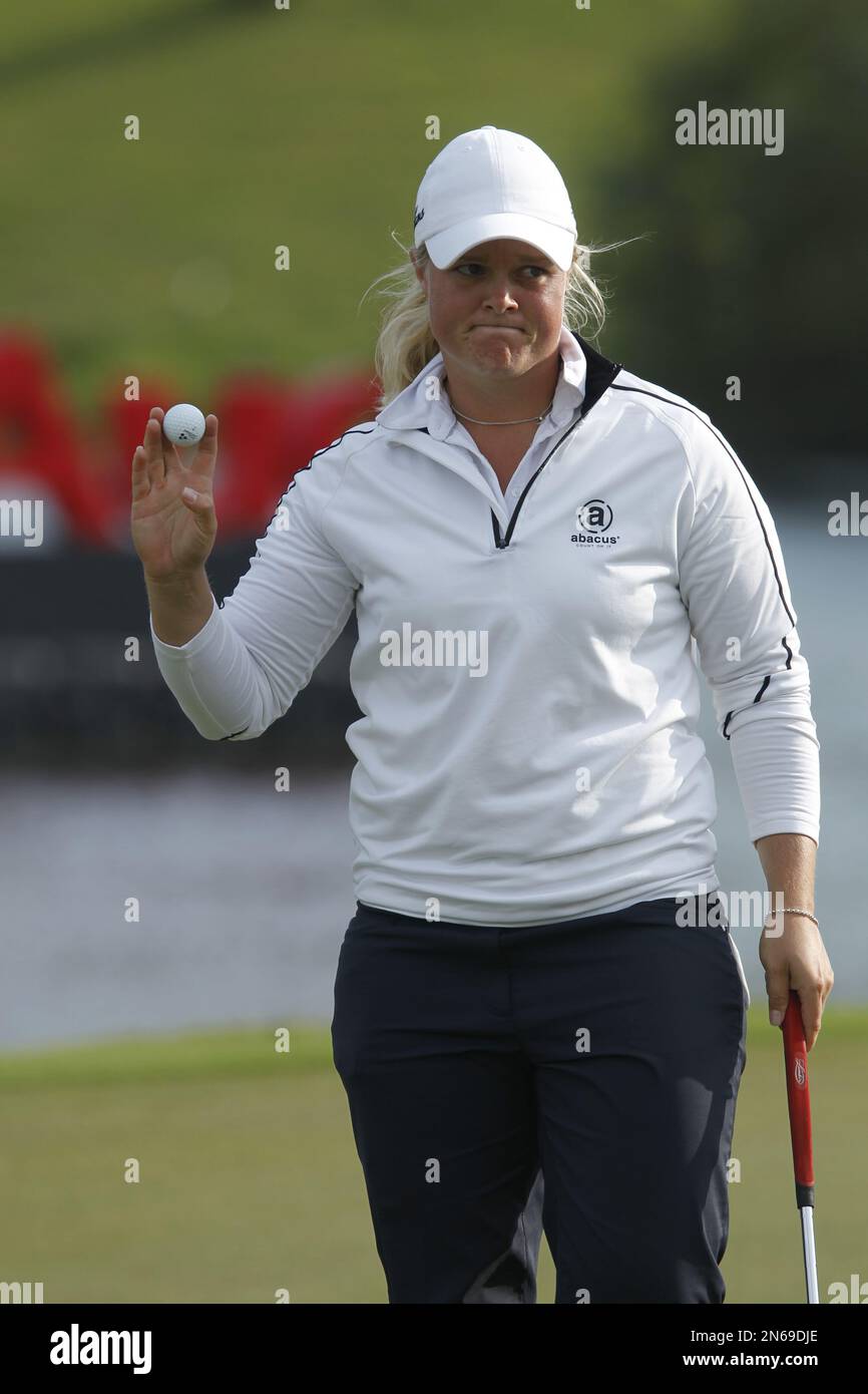 Caroline Hedwall of Sweden, shows her ball as she finishes the 18th ...