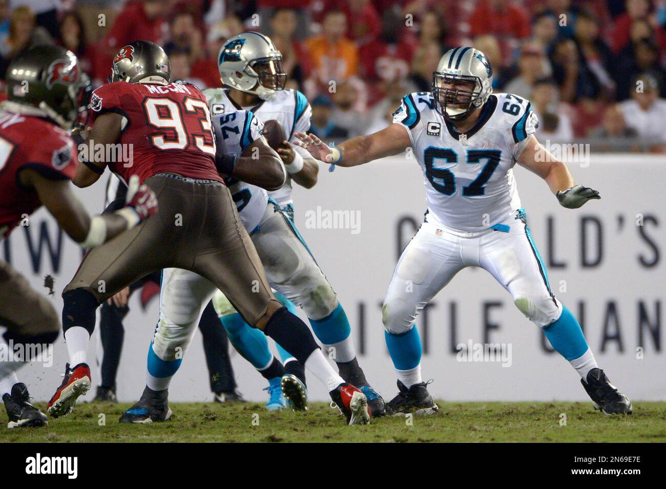 Carolina Panthers center Ryan Kalil (67) helps guard Chris Scott (75 ...