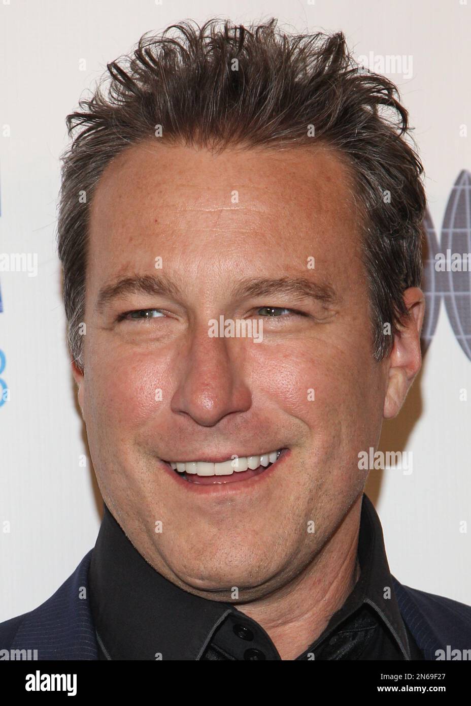 Actor John Corbett arrives at the International Women’s Media ...